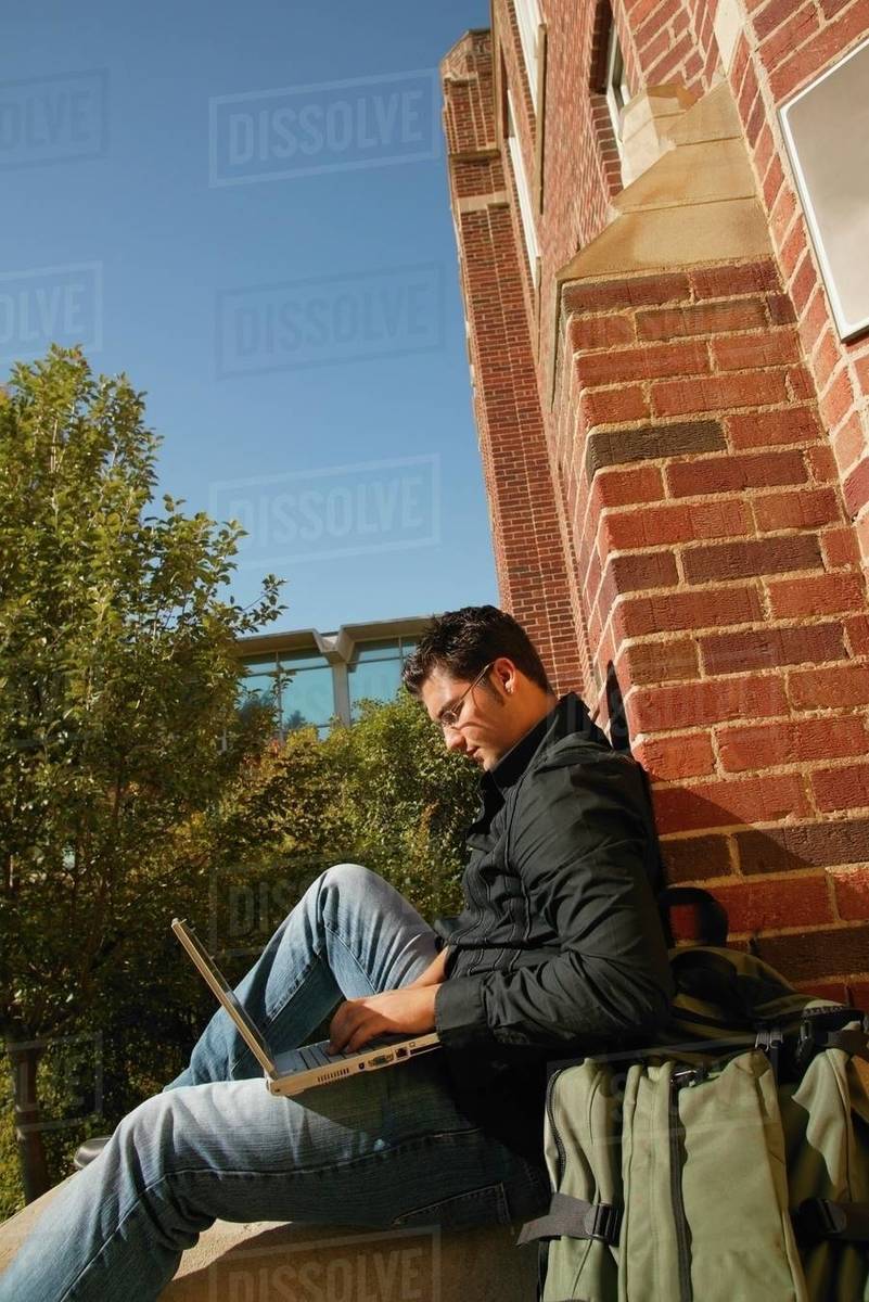Youth Working On Laptop - Royalty-free Stock Photo | Dissolve