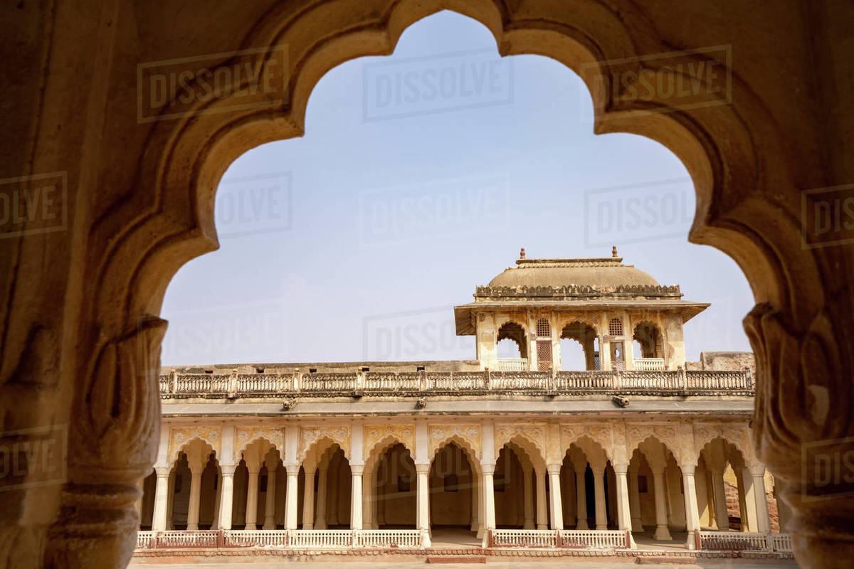 Arched view to the colonnaded walkway and inner courtyard in ...