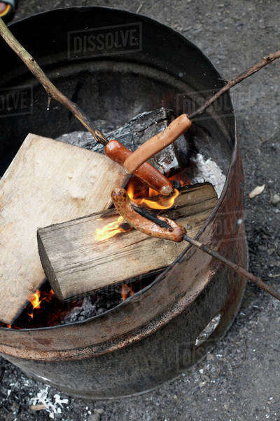 Hot Dogs On Sticks Cooking Over A Fire - Royalty-free Stock Photo ...
