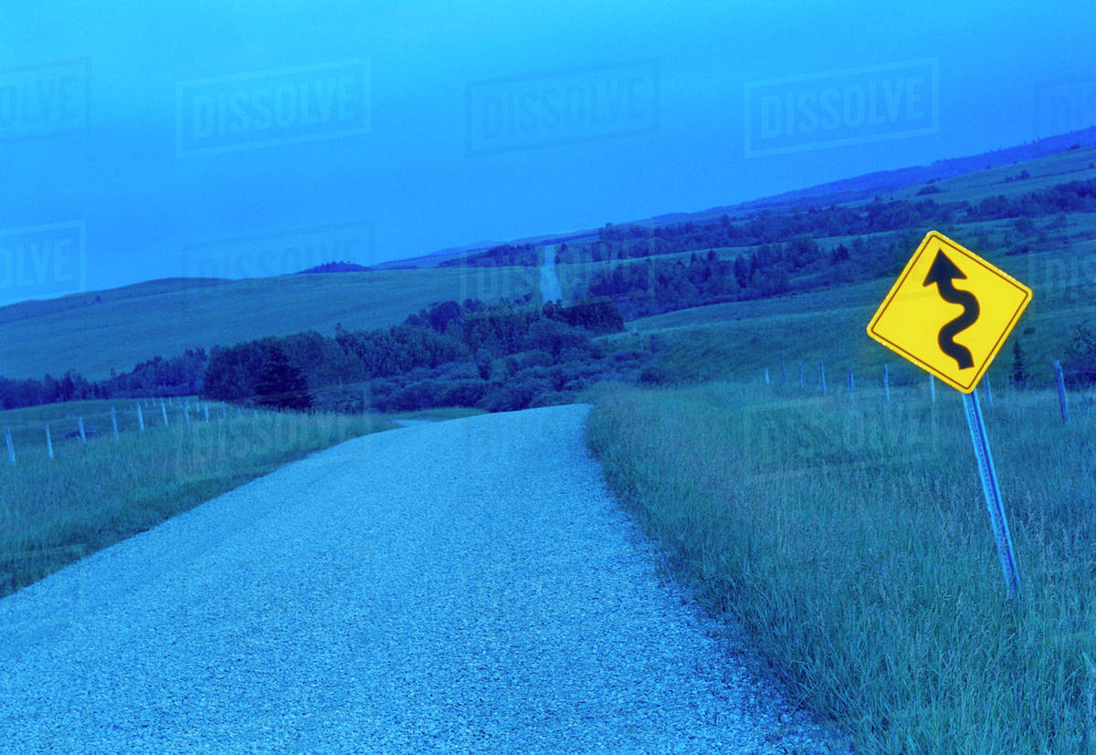 Blue Toned Winding Rural Road With Bright Yellow Road Sign, Canada ...