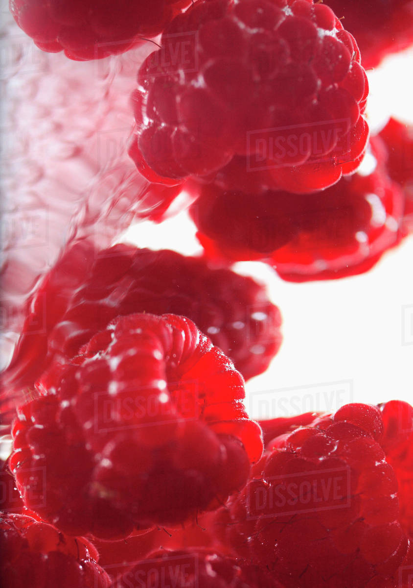 Raspberries Floating In Water - Royalty-free Stock Photo | Dissolve