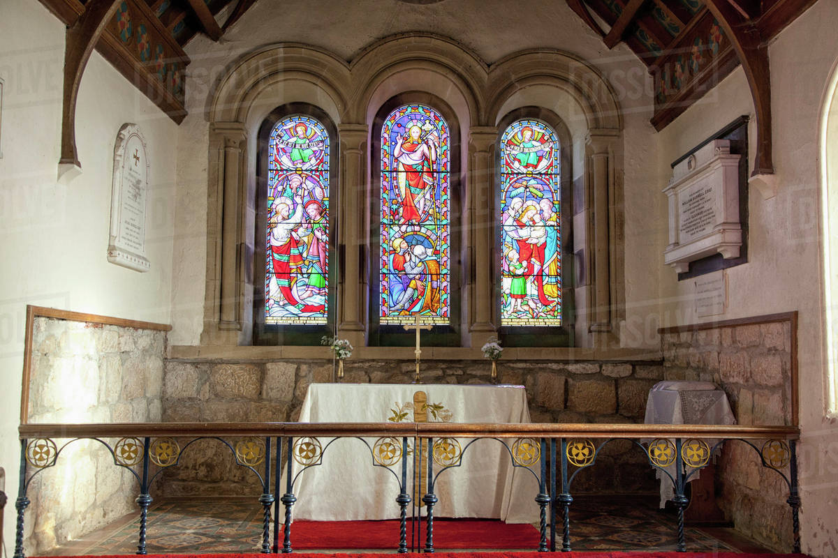 Stained Glass Windows At The Altar Of A Church; Northumberland, England ...