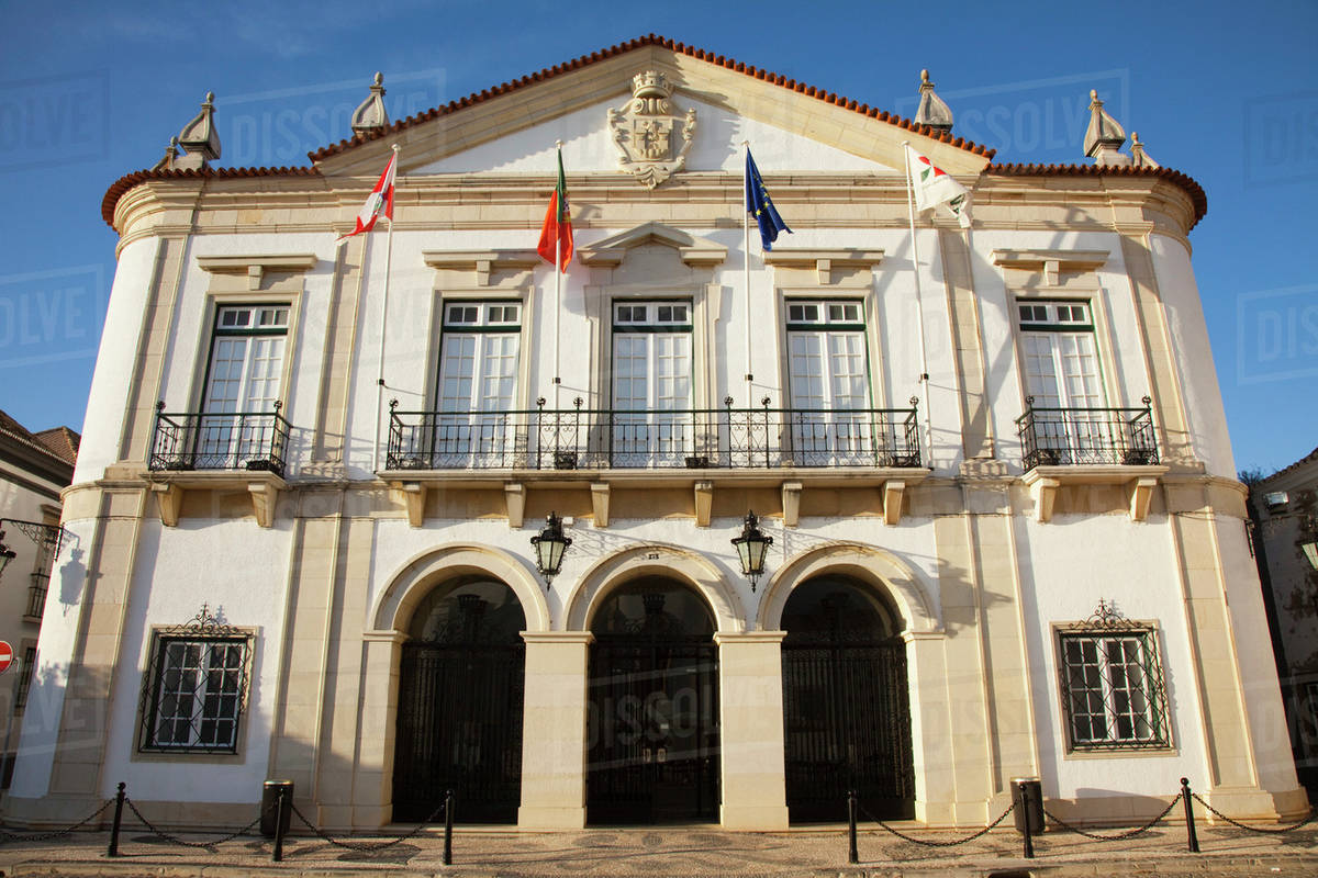 The Front Of A Building With Flags Lining The Balcony; Faro Algarve ...