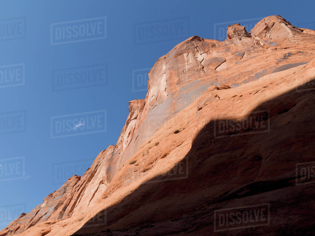 Top Of A Rock Cliff Against A Blue Sky; Arizona, United States of ...