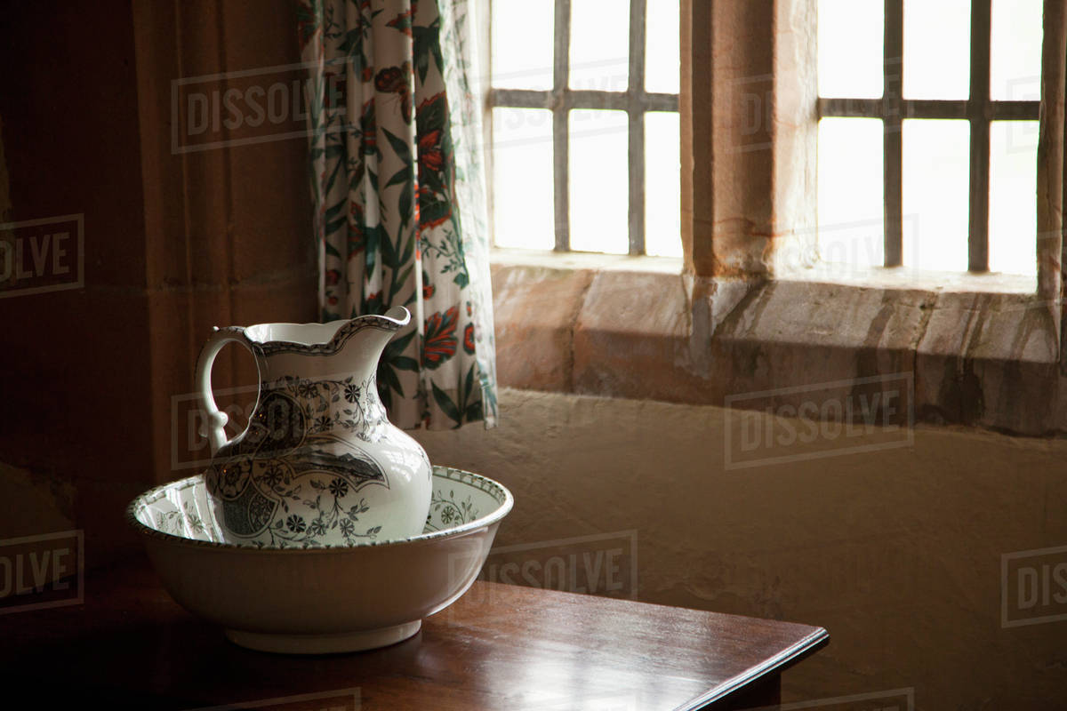 A Pitcher And Basin Sit On The Table Beside A Window; Lindisfarne ...