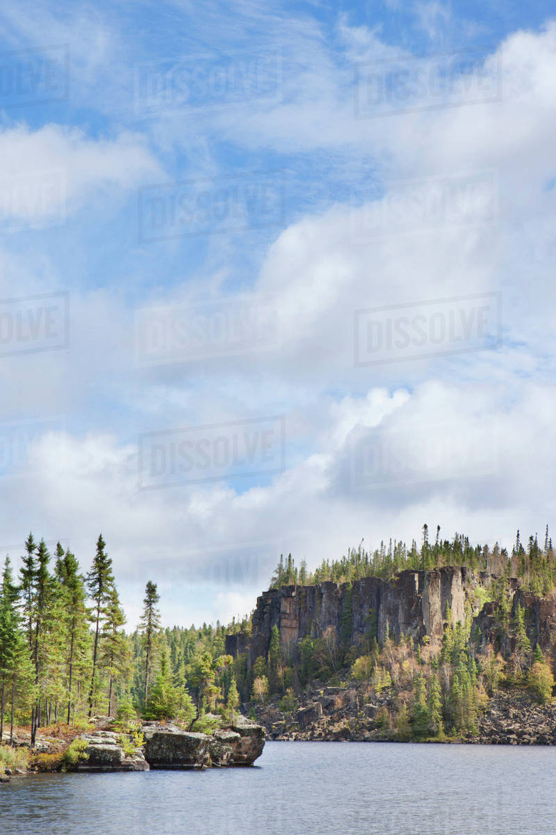 Granite Rock Formations Along The Shoreline Of A Lake; Armstrong ...