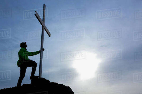 A Man Looks Up At Cross Located At The Top Of Mt. Tzouhalem In The ...