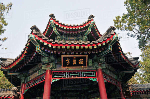 A building with traditional chinese architecture against a blue sky ...