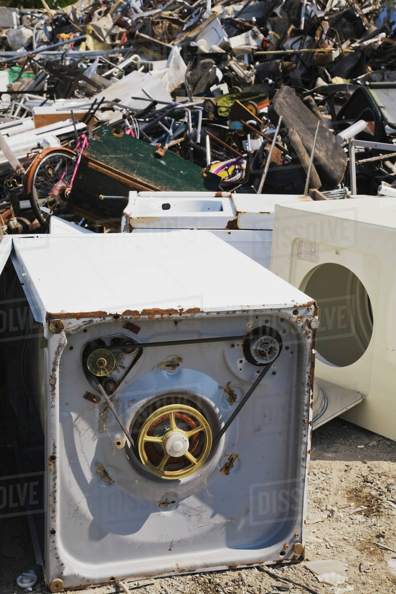 Pile of discarded household and industrial items at a scrap metal ...