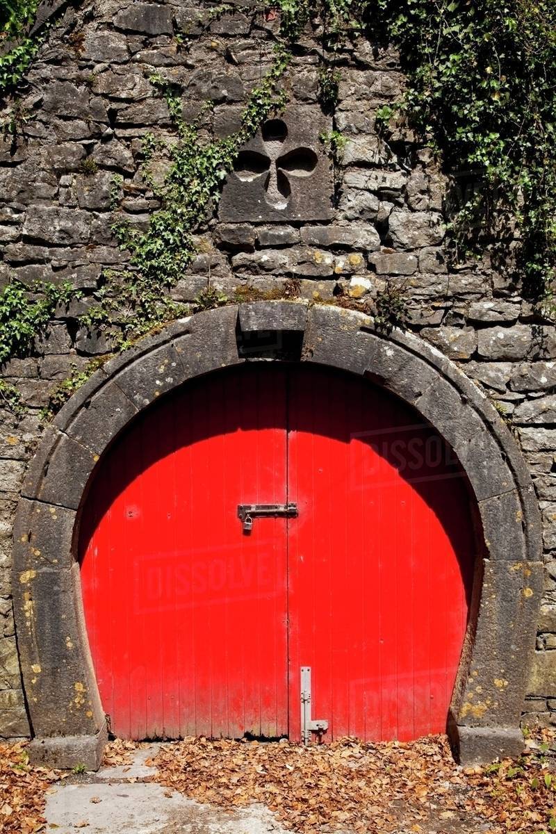 Rounded Red Door; Cong, County Mayo, Ireland - Stock Photo - Dissolve