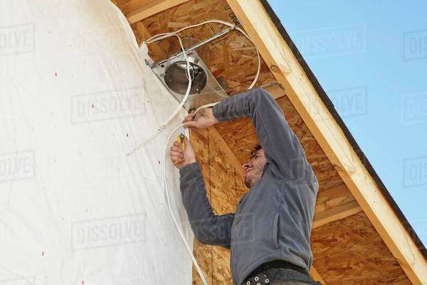 Electrician Installing Light Fixtures On House - Royalty-free Stock ...
