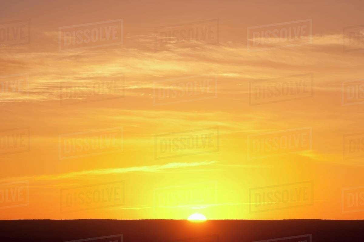 Sunrise Over Level Horizon; Florida, Usa - Stock Photo - Dissolve