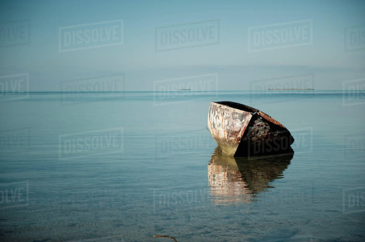 Empty Boat Moored In Ocean - Royalty-free Stock Photo | Dissolve
