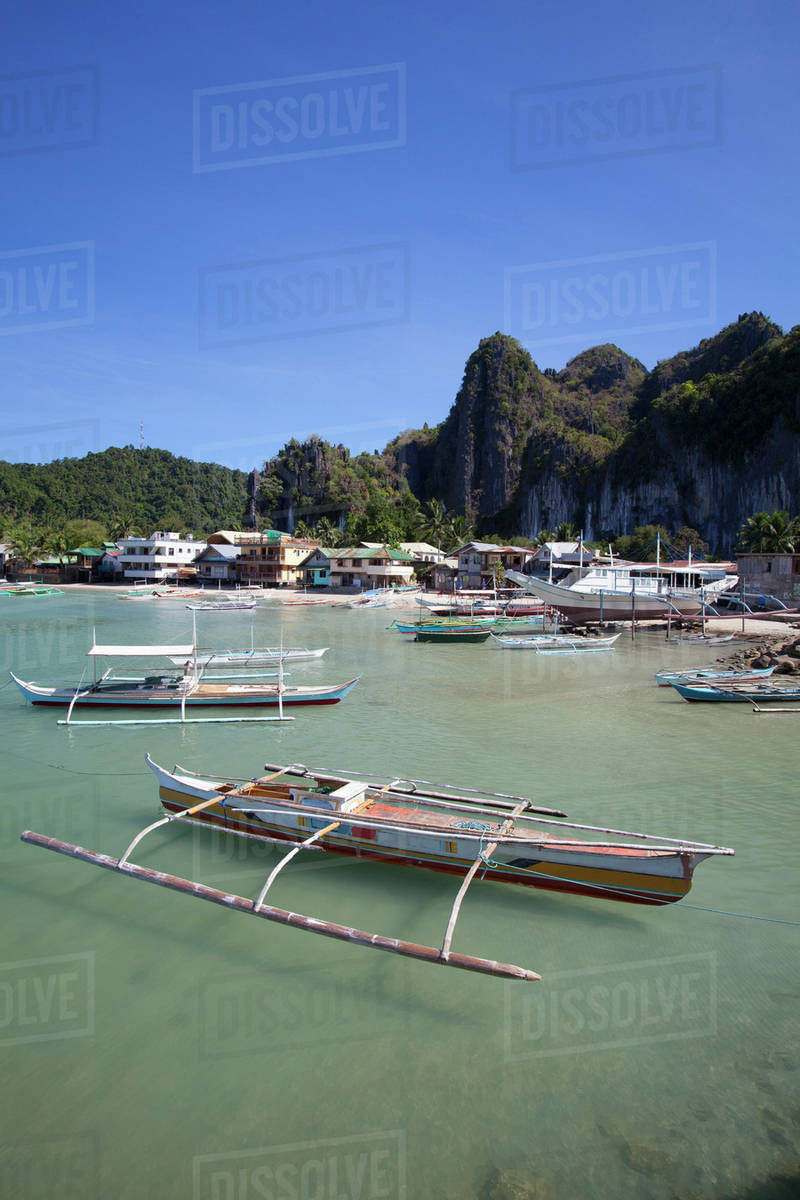 Bangka Boats Sit In The Picturesque And Scenic Bay; El Nido, Bacuit ...