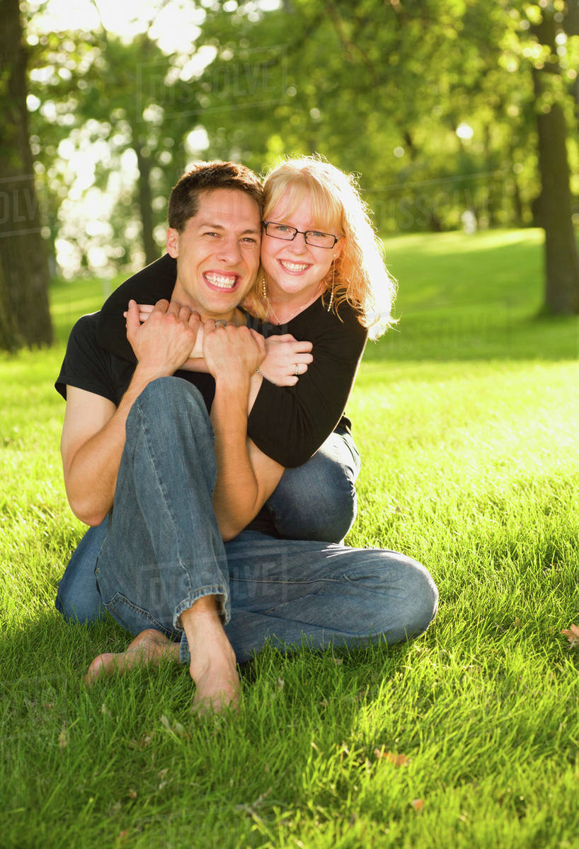 Young Couple Hugging In A Park; Willmar Minnesota United States Of ...