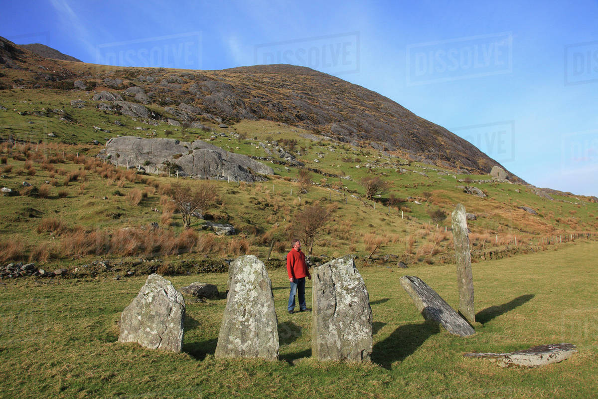 A Man Stands In A Stone Circle; Lauragh, County Kerry, Ireland ...