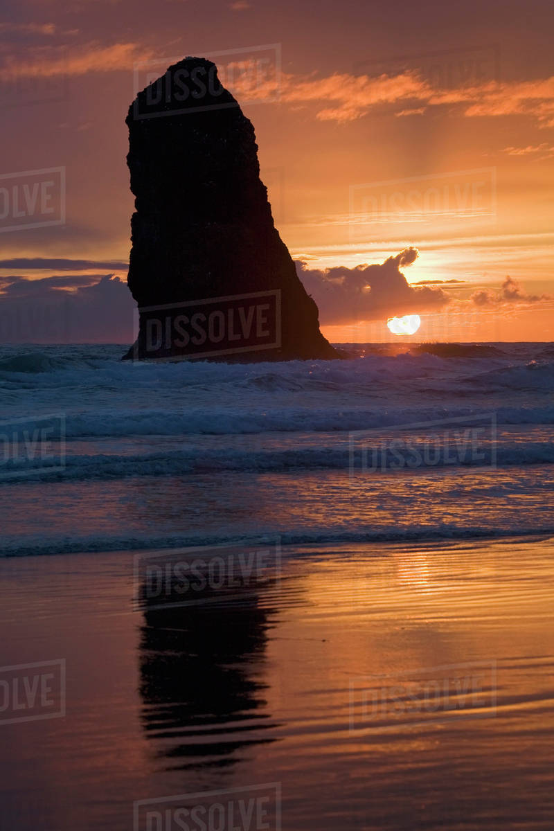 Silhouette Of A Rock Formation At Sunset; Cannon Beach, Oregon, United ...