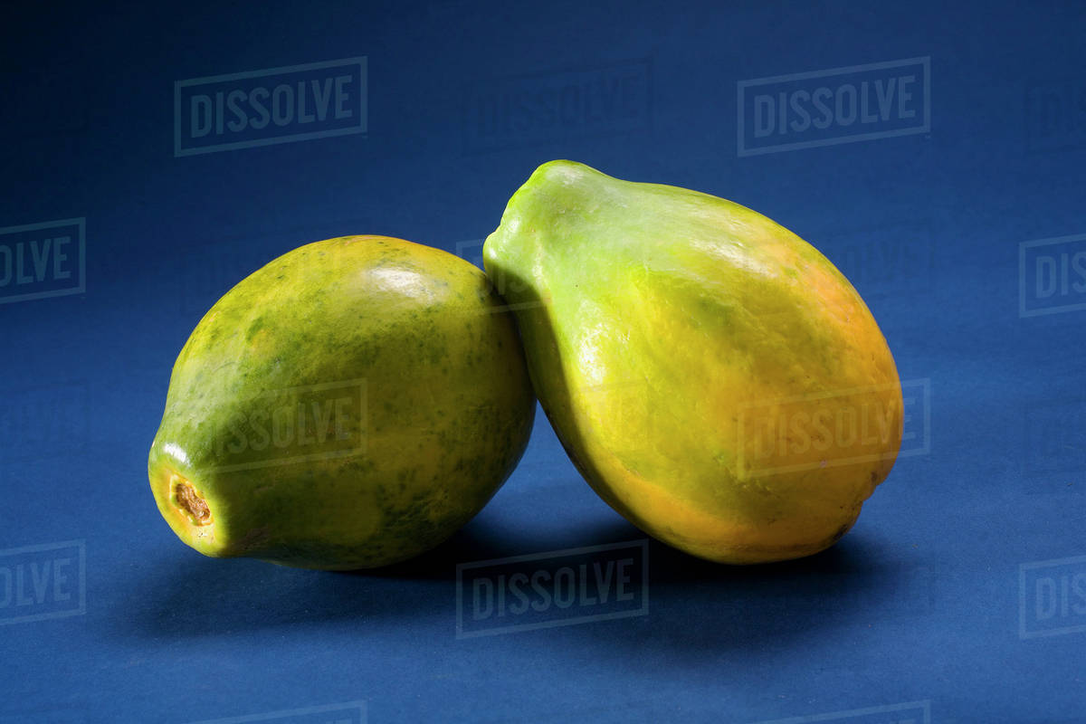 Studio Shot Of Two Papayas. - Royalty-free Stock Photo | Dissolve
