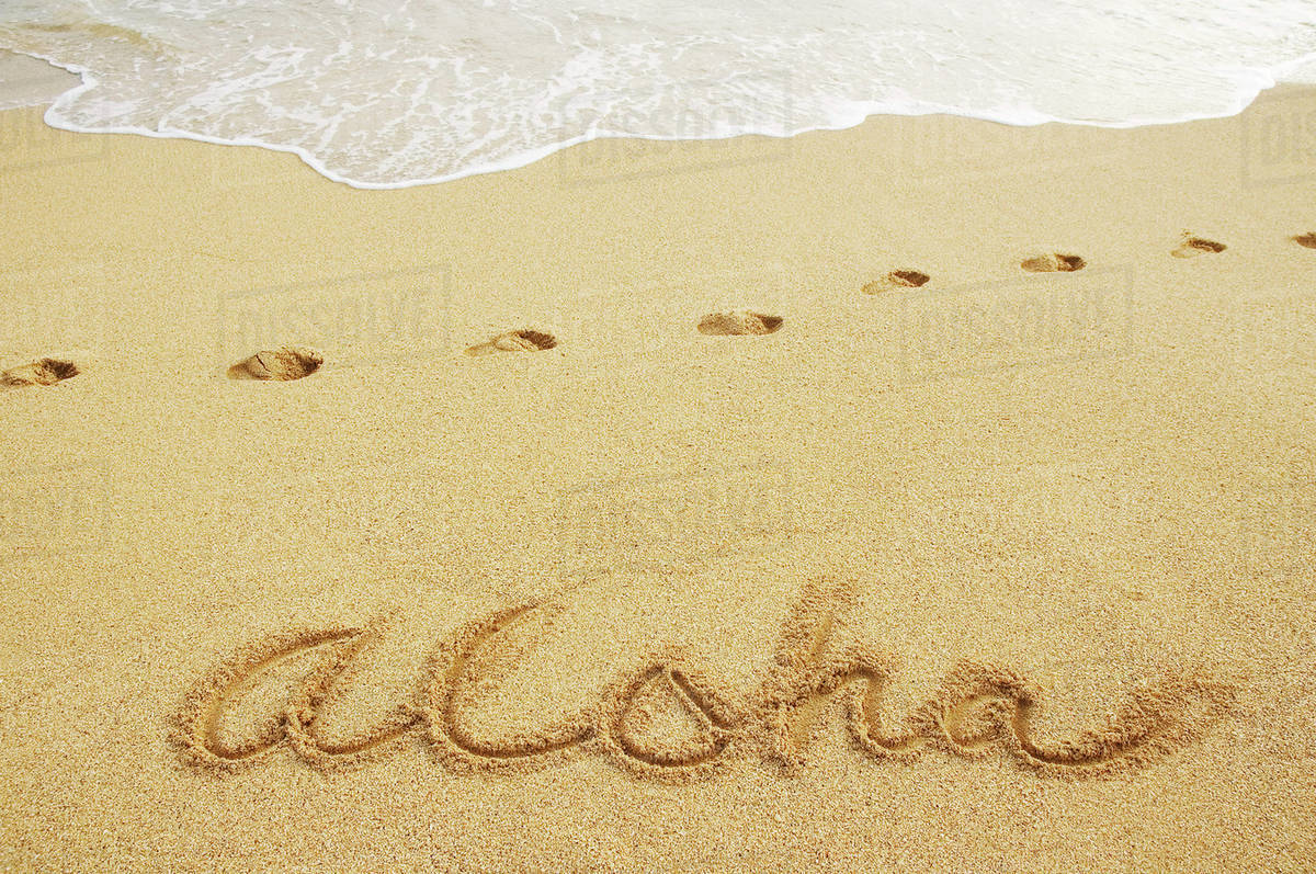 Aloha Written In Sand With Footprints And Wave Wash. - Royalty-free ...