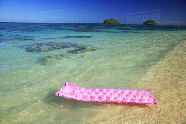 Hawaii, Oahu, Lanikai, Pink Inflated Raft On Clear Ocean Water, Mokulua ...