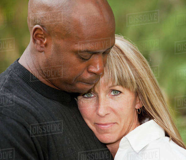 Interracial Couple Enjoying Each Other's Company In A Park; Edmonton ...