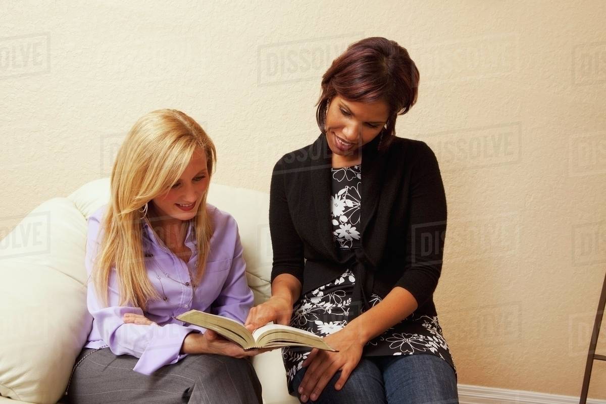 Two Women Reading The Bible Together - Royalty-free Stock Photo | Dissolve