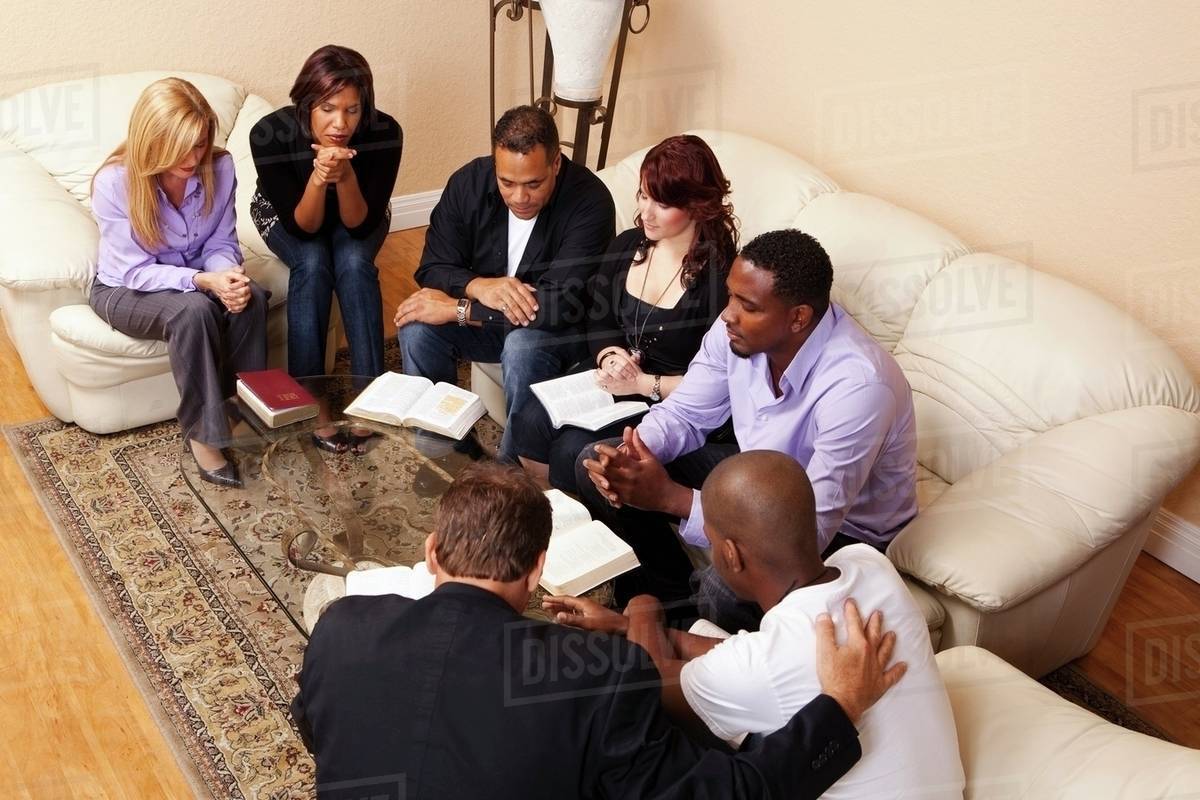 A Group Of Adults Praying With Their Bibles Open - Royalty-free Stock ...