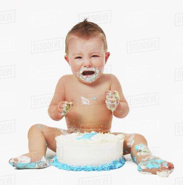 Edmonton, Alberta, Canada; A Baby Crying And Covered In Icing As He ...