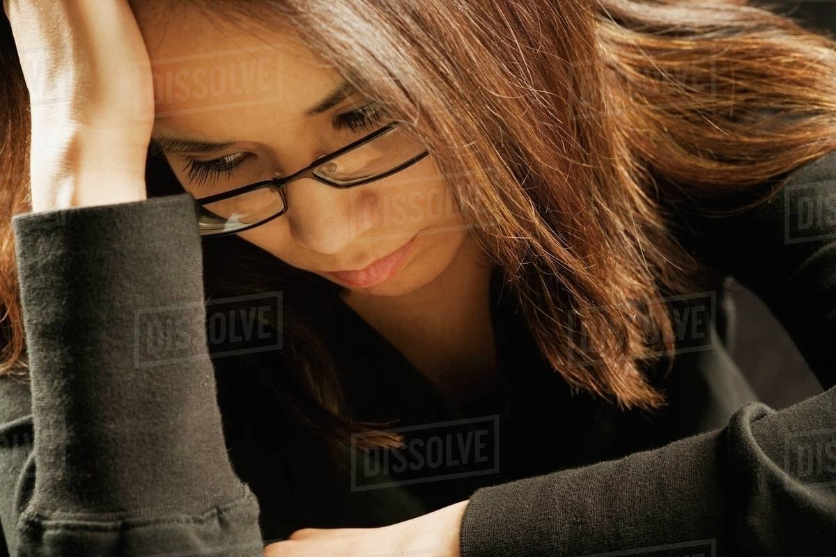A Young Woman Looking Sad - Royalty-free Stock Photo | Dissolve