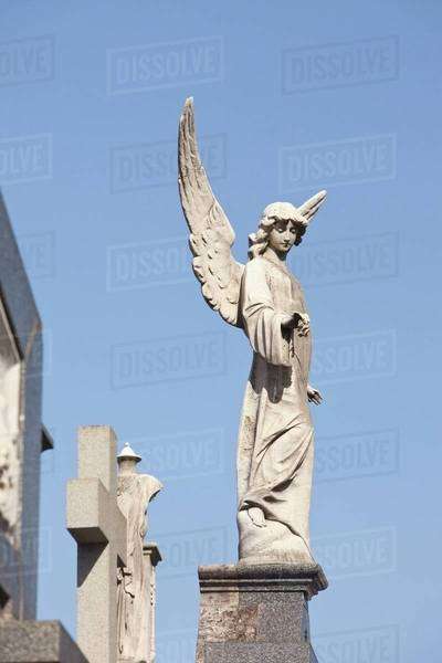 Buenos Aires, Argentina; Angel Statues And A Cross Made Of Stone On Top ...