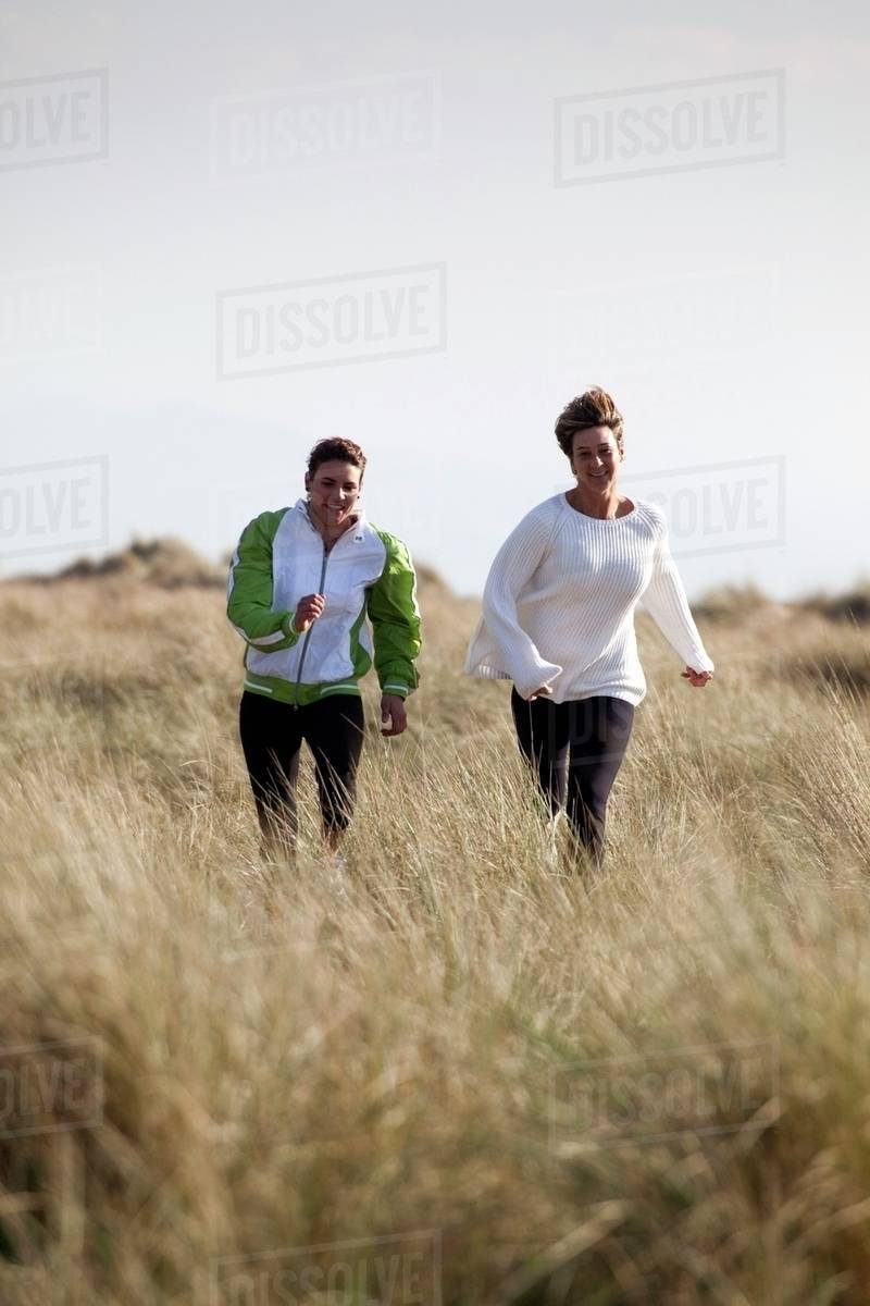 Two Women Running - Stock Photo - Dissolve