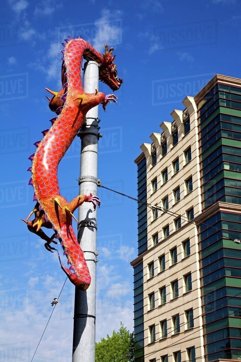 Seattle, Washington State, Usa; Dragon On Pole In Chinatown ...