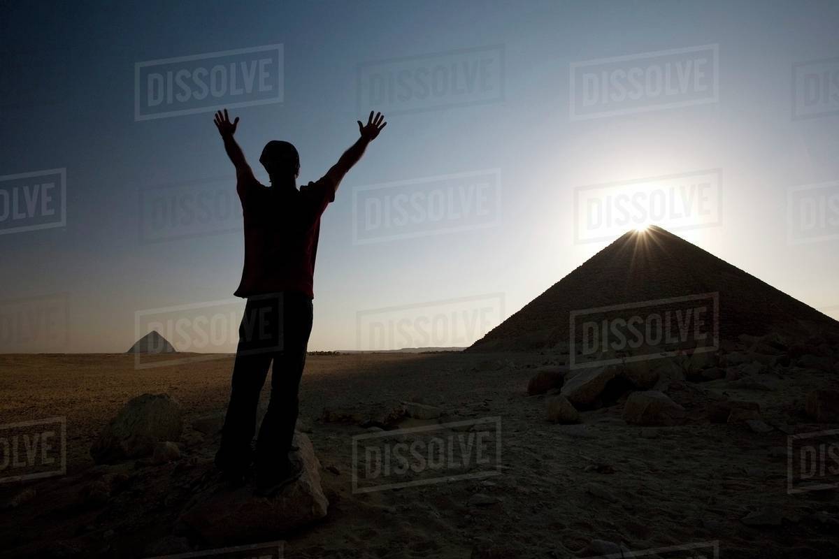 Man With Arms Raised In Front Of The Red Pyramid, Dahshur, Egypt ...