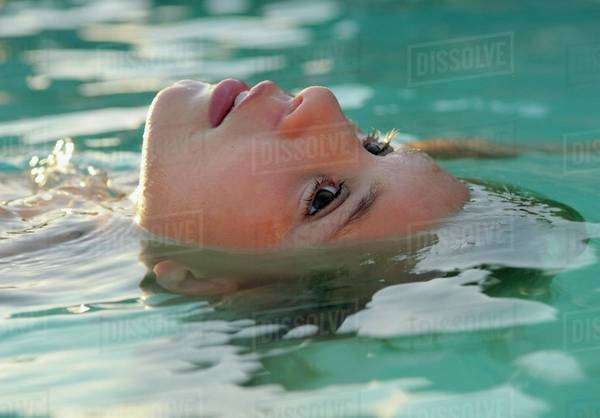 Girl Floating In The Water - Royalty-free Stock Photo | Dissolve