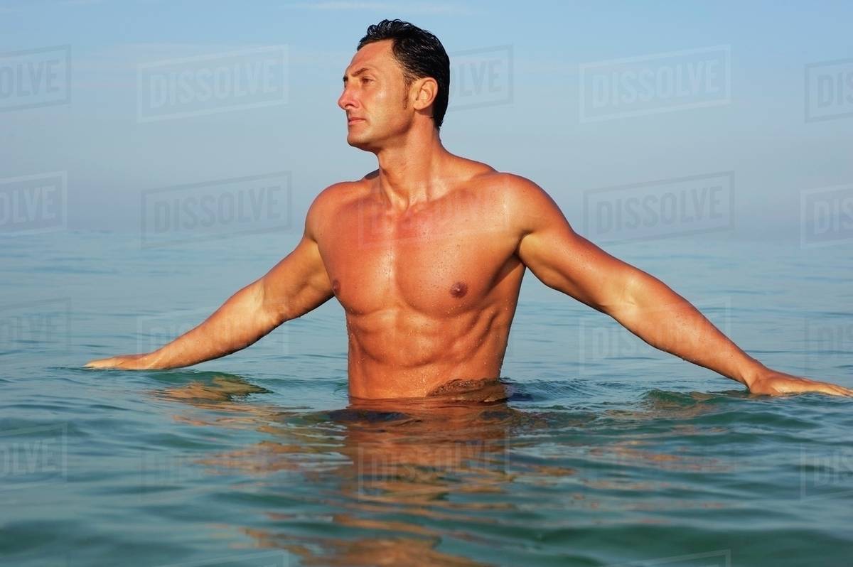 Man Wading In The Water; Playa Los Lances, Tarifa, Cadiz, Andalusia ...