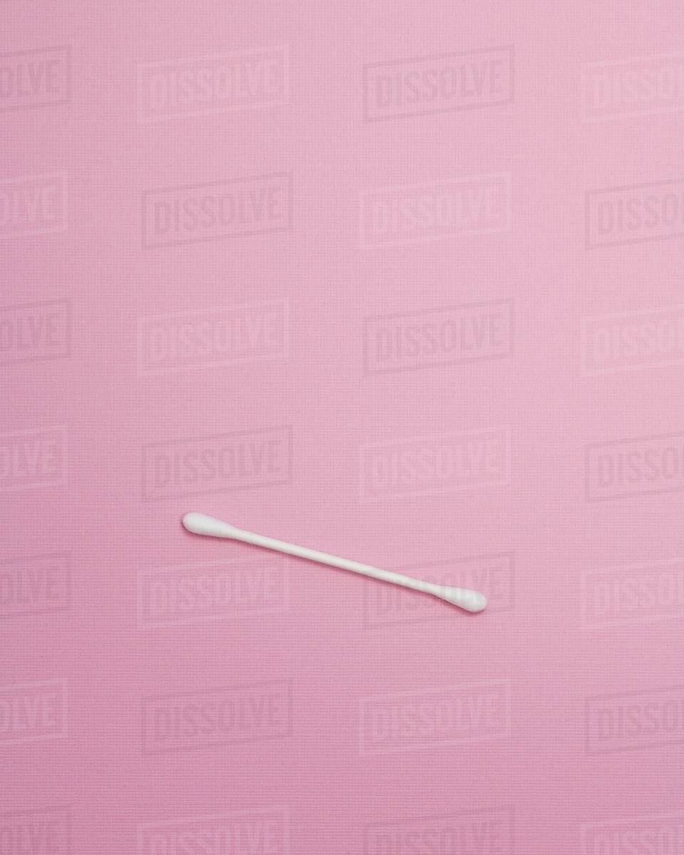 One Cotton Swab On Pink Surface - Royalty-free Stock Photo | Dissolve