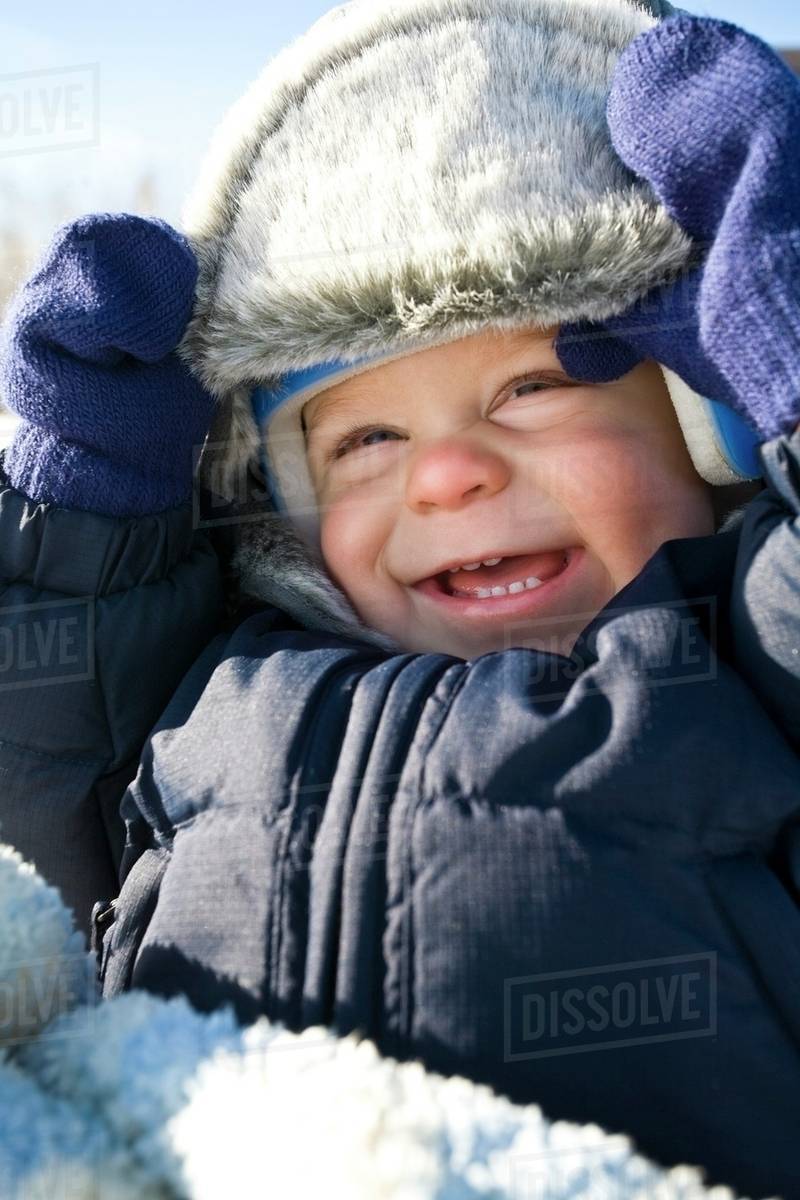Baby In The Snow - Stock Photo - Dissolve