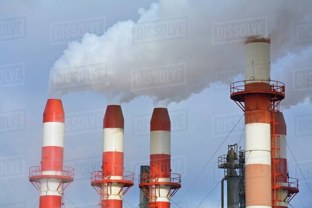 Oil Refinery Chimneys - Stock Photo - Dissolve