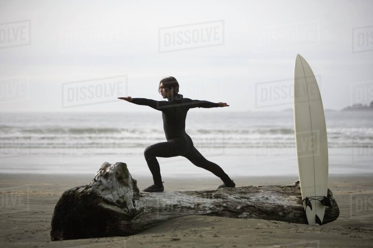Surfer Stretching On Beach, Cox Bay Near Tofino, British Columbia ...