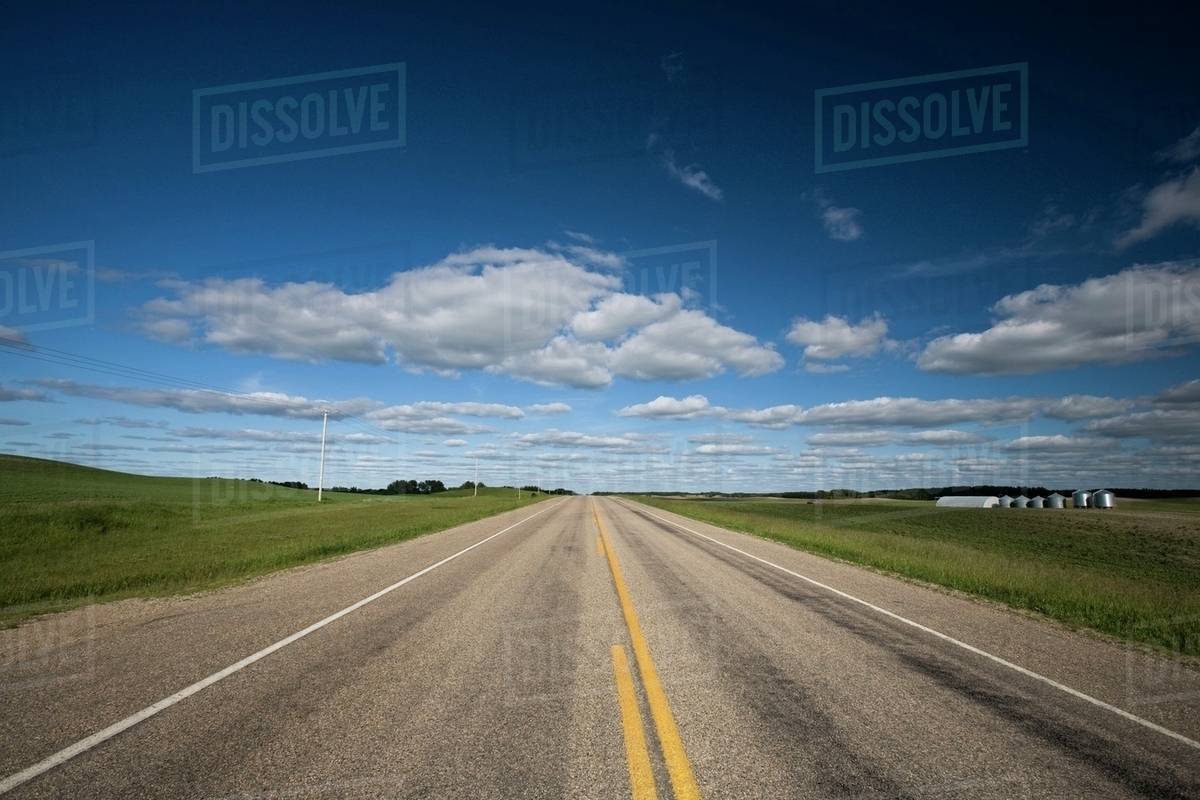 Highway Running Through The Prairies - Royalty-free Stock Photo | Dissolve