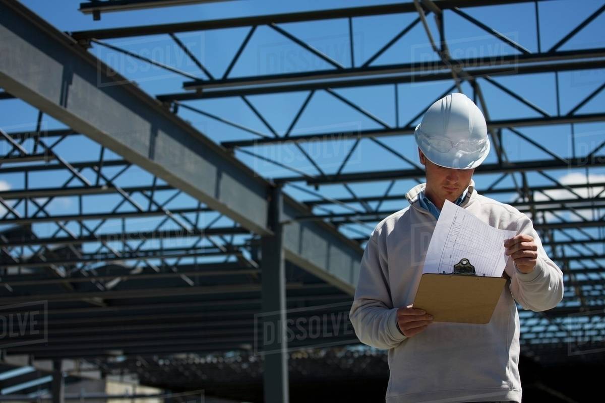 Engineer With Clipboard On Construction Site - Royalty-free Stock Photo ...