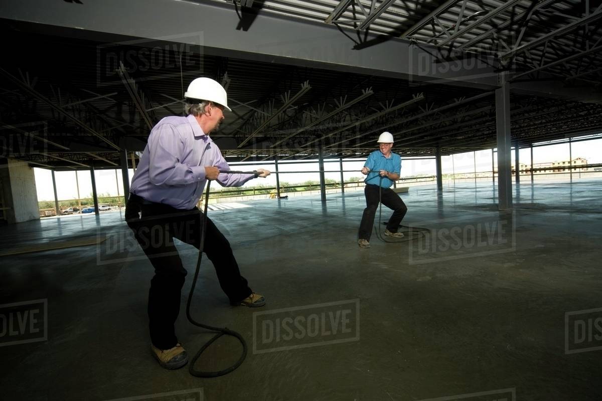 Two Workers Fighting - Stock Photo - Dissolve