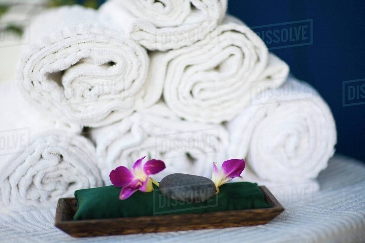 Rolled Towels And Spa Rocks - Stock Photo - Dissolve
