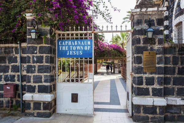Present day entrance to the historic village of Capernaum with a sign ...