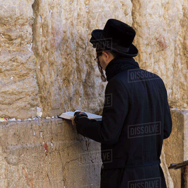 An orthodox jew standing at the Wailing Wall, old city of Jerusalem ...