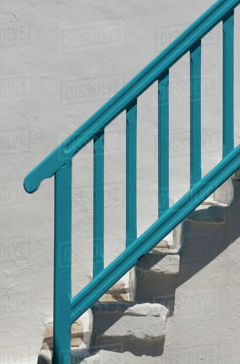 A blue railing on white painted stone stairs; Mykonos Town, Mykonos ...