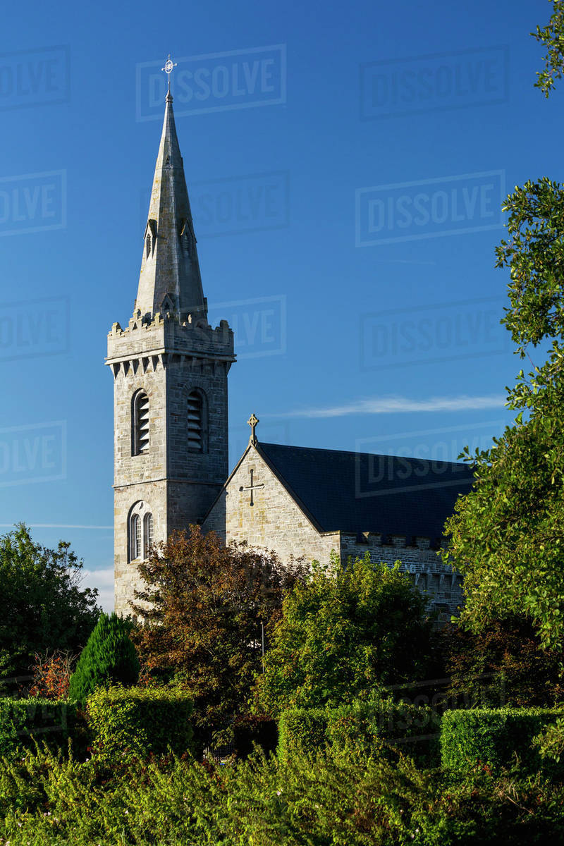 Old stone church steeple with blue sky; Kilrush, County Clare, Ireland ...