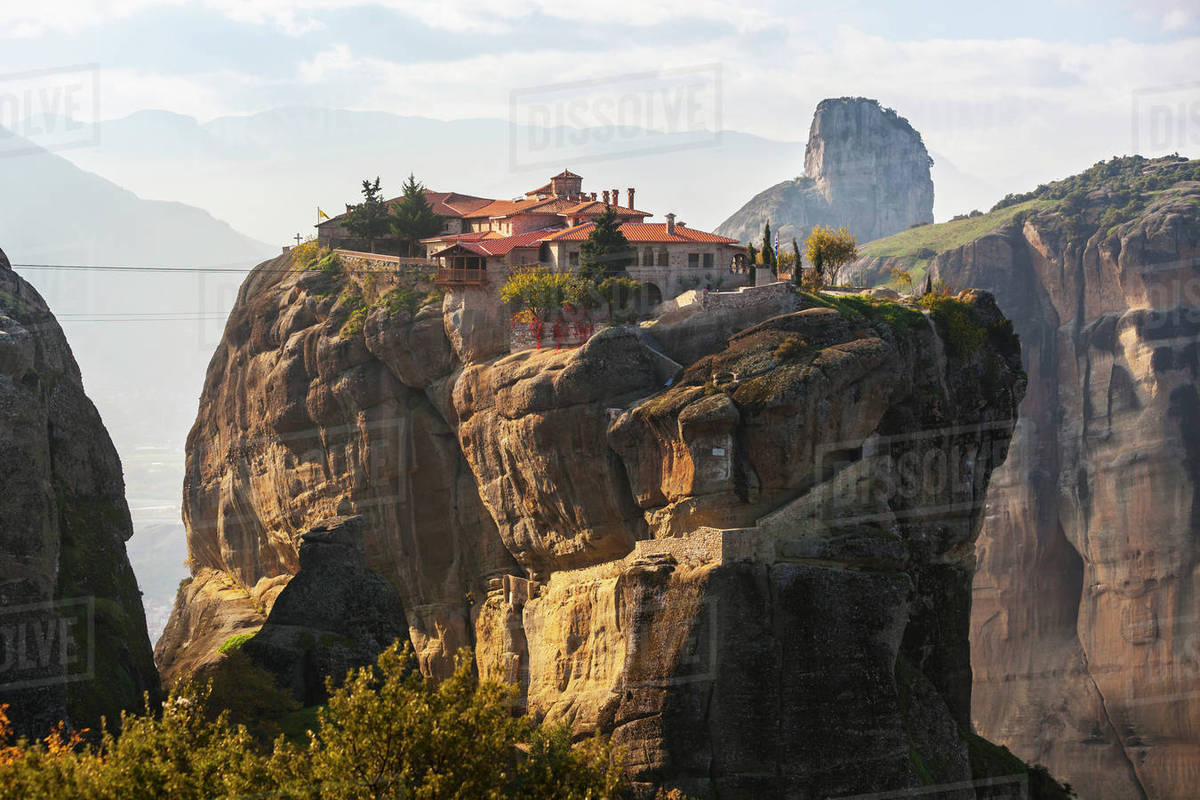 Monastery On The Edge Of A Cliff; Meteora, Greece - Stock Photo - Dissolve