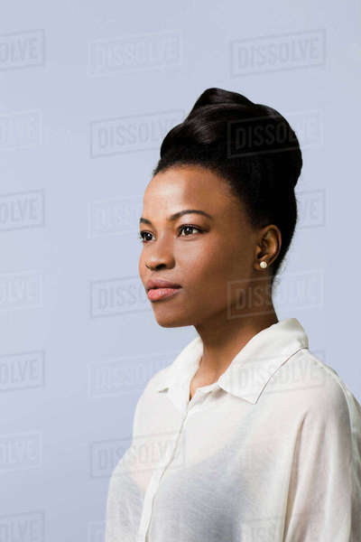 Close Up Portrait Of An African Canadian Woman Against Blue Wall ...