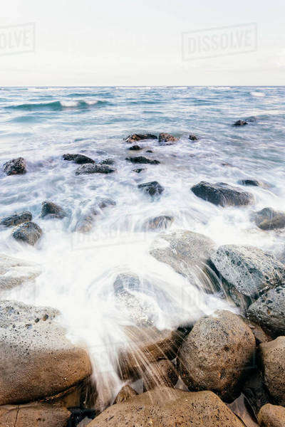 Surf washing up around rocks; Wailua, Kauai, Hawaii, United States of ...